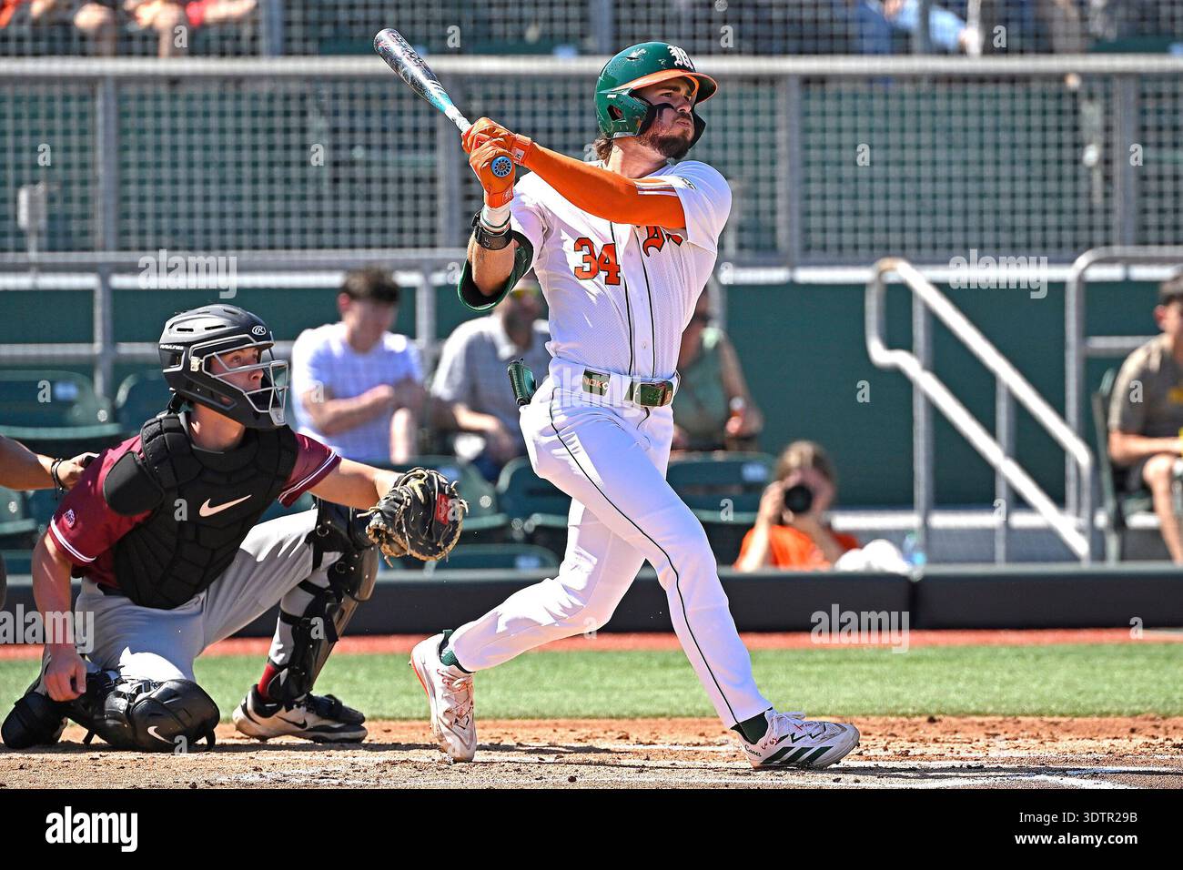 CORAL GABLES, FL - FEBRUARY 22: Miami outfielder Michael Torres (34 ...