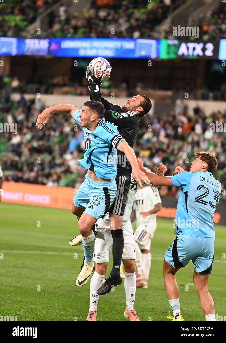 AUSTIN, TX - FEBRUARY 21: Austin FC goalie Brad Stuver (center) gathers ...