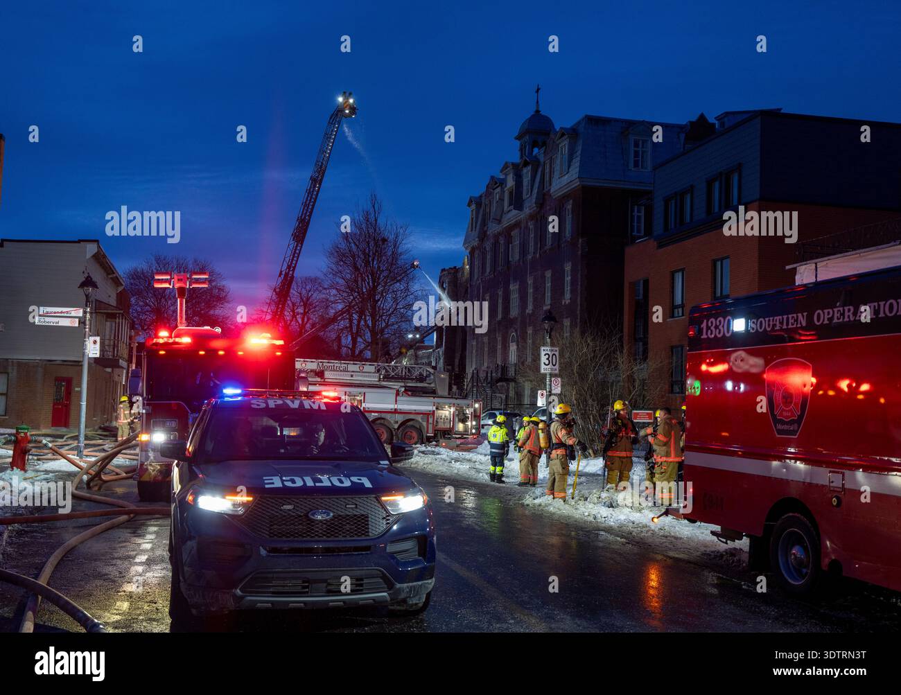 Firefighters respond to a five-alarm fire at Saint-Paul Catholic Church ...