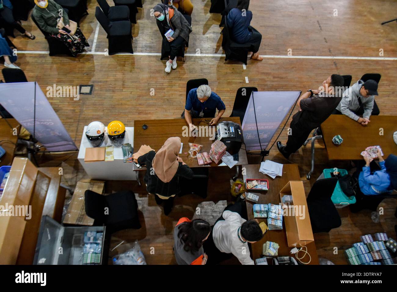 February 23, 2026, Bandung, West Java, Indonesia: People exchange their ...