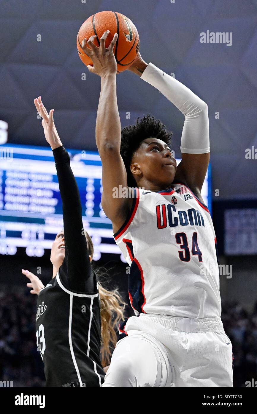 UConn forward Ayanna Patterson (34) grabs a rebound against Providence ...