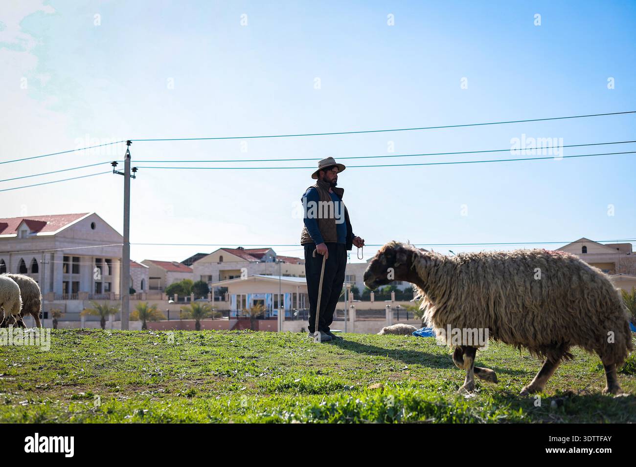 Kurdish shepherd Mohamad Hashim rests with his prayer beads and ...