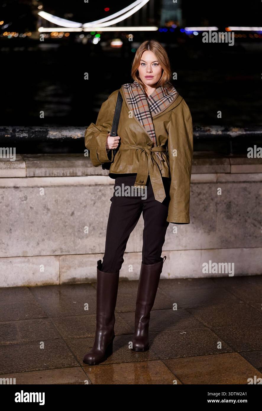 Camille Rowe attends the Burberry show at 1 Old Billingsgate Walk ...
