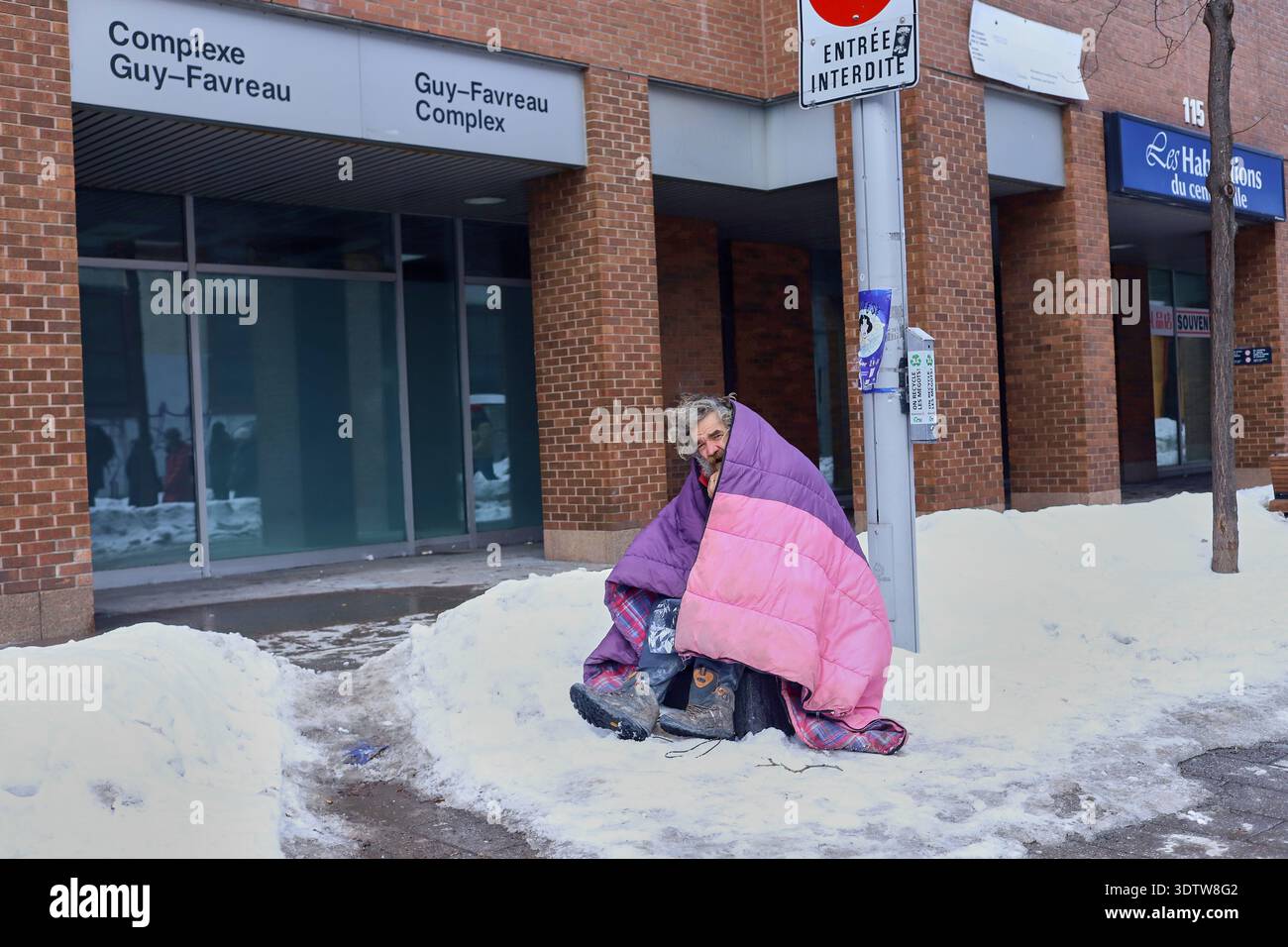 A homeless is seen outside of the Guy-Favreau Complex as temperatures ...