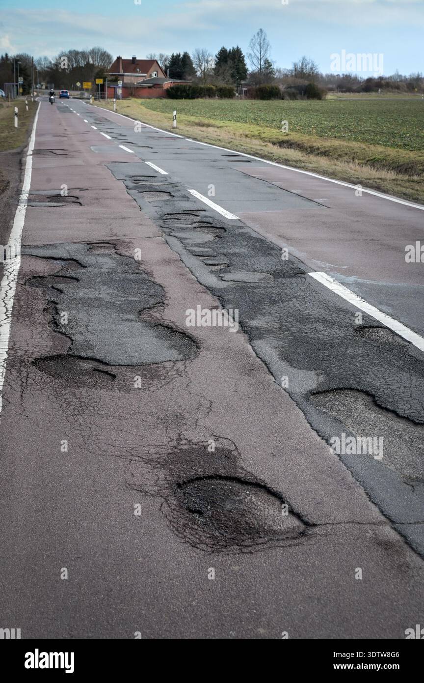 21 February 2026, Saxony-Anhalt, Plötz: Road damage due to potholes ...