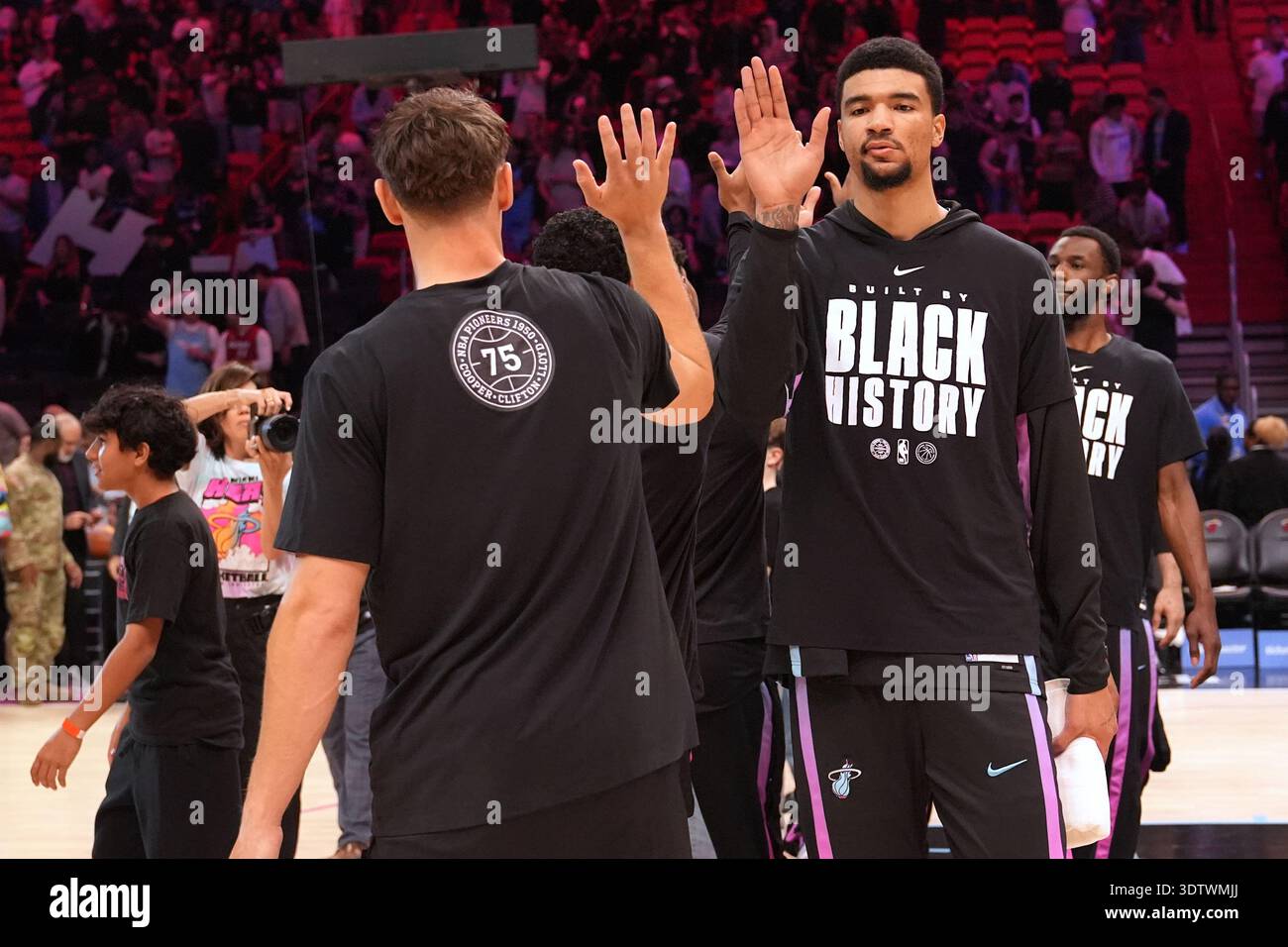 Miami Heat center Kel'el Ware greets his teammates before an NBA ...