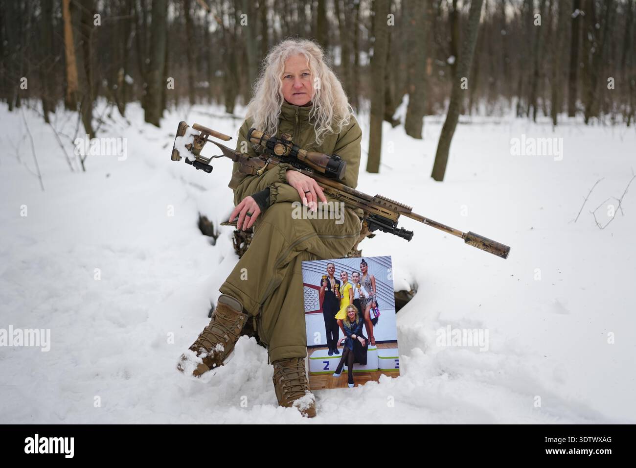 Tetiana Khimion 47, now a sniper in the Ukrainian army, poses with a ...