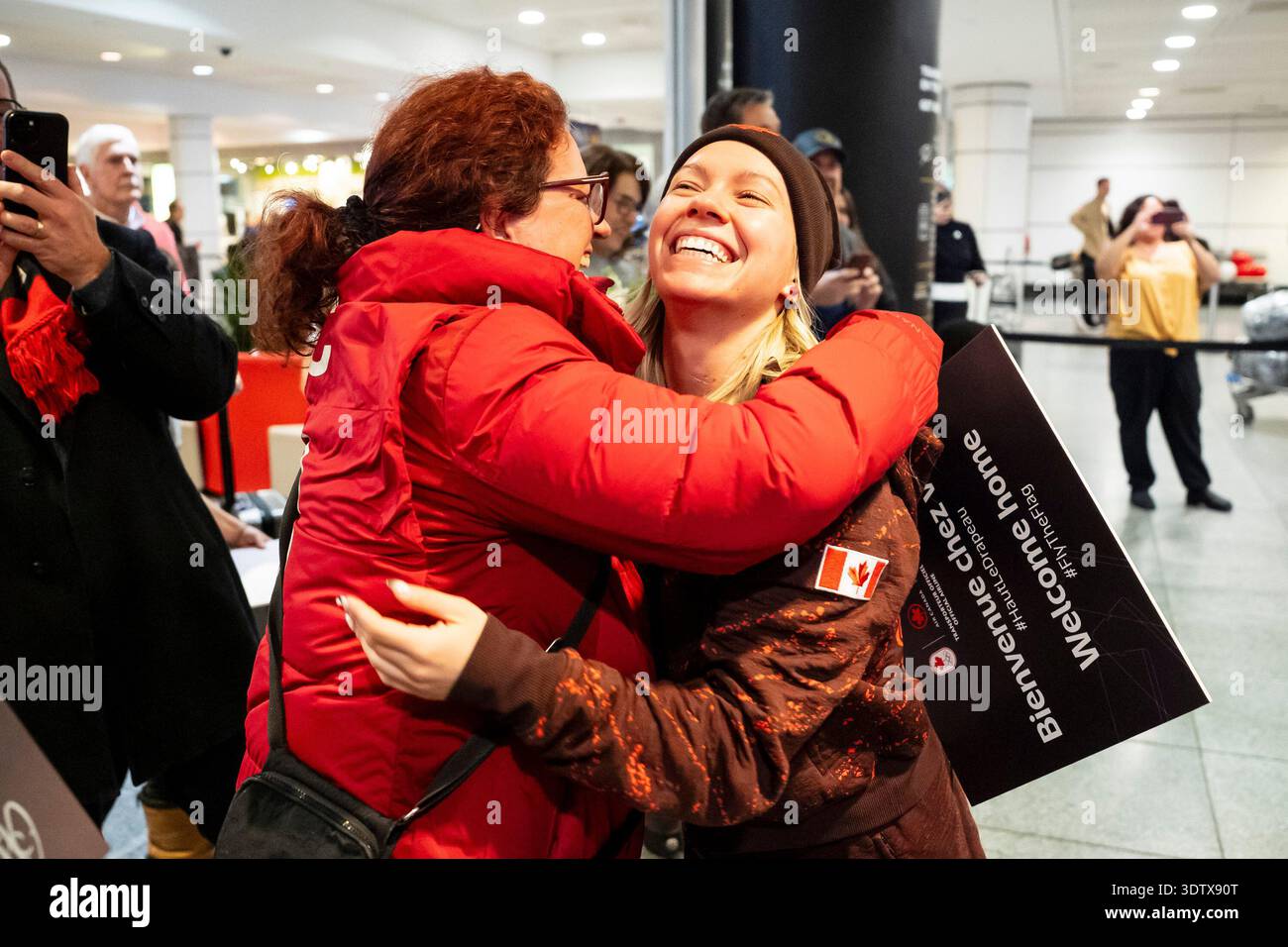 Canadian ice dancer Marjorie Lajoie hugs her mother Julie Carignan ...