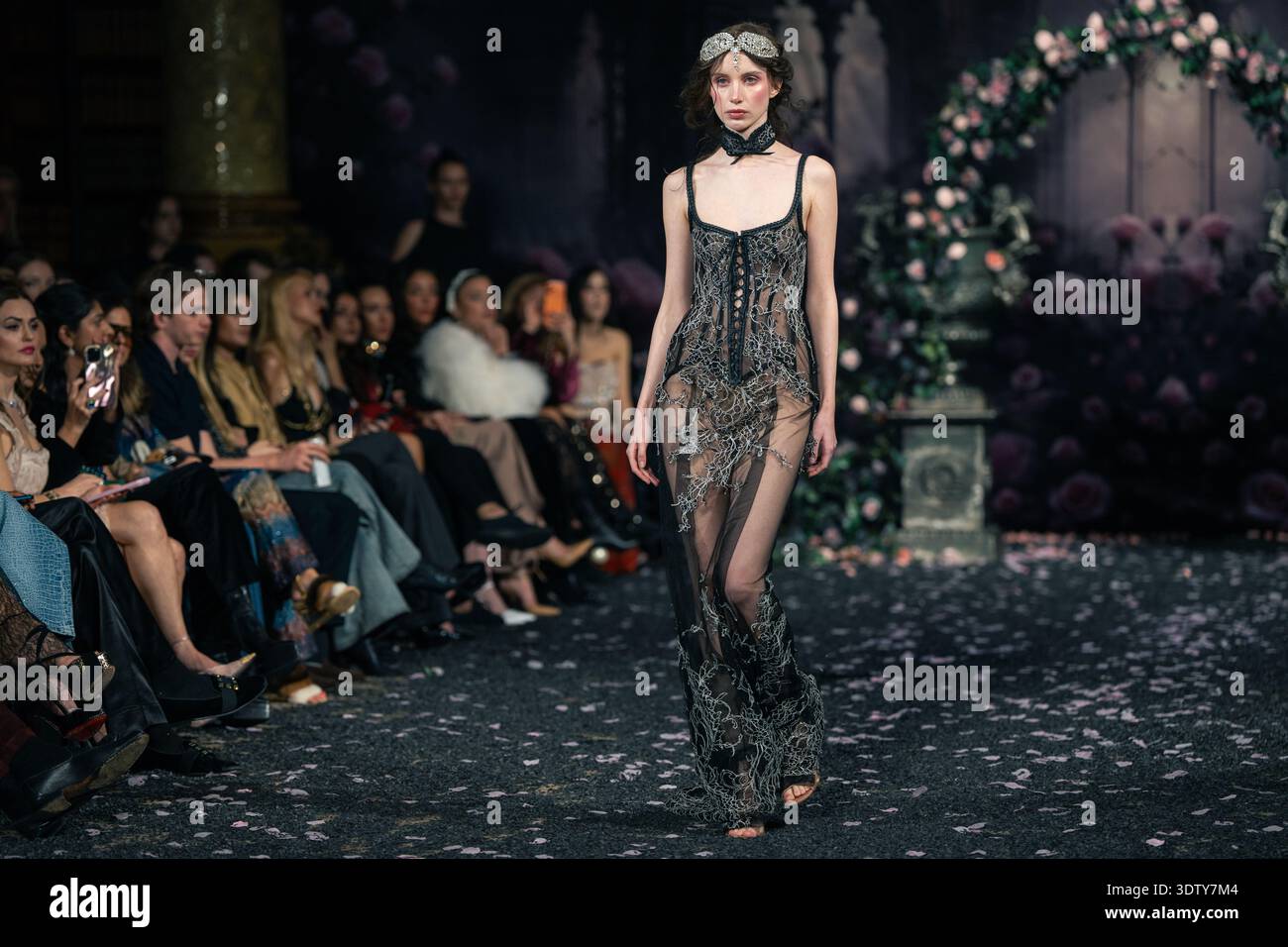 London, UK. 23rd Feb, 2026. A model walks the runway at the Aadnevik ...