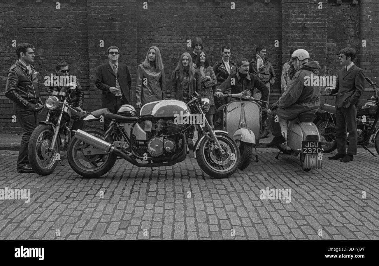 Mods and Rockers posing with scooter and motorbike in London showcasing ...