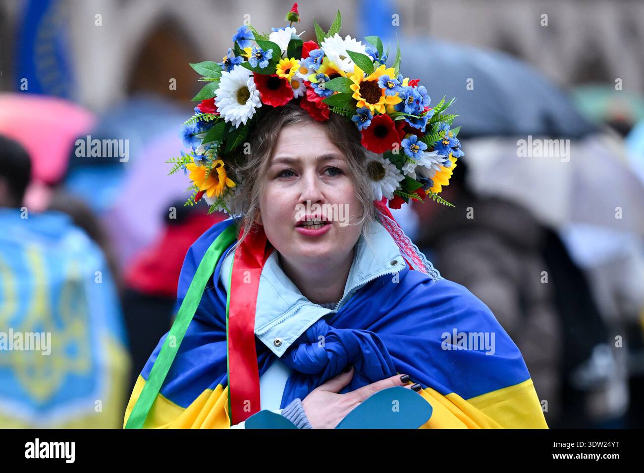 A woman takes part in a rally in Munich, Germany, to mark four years ...
