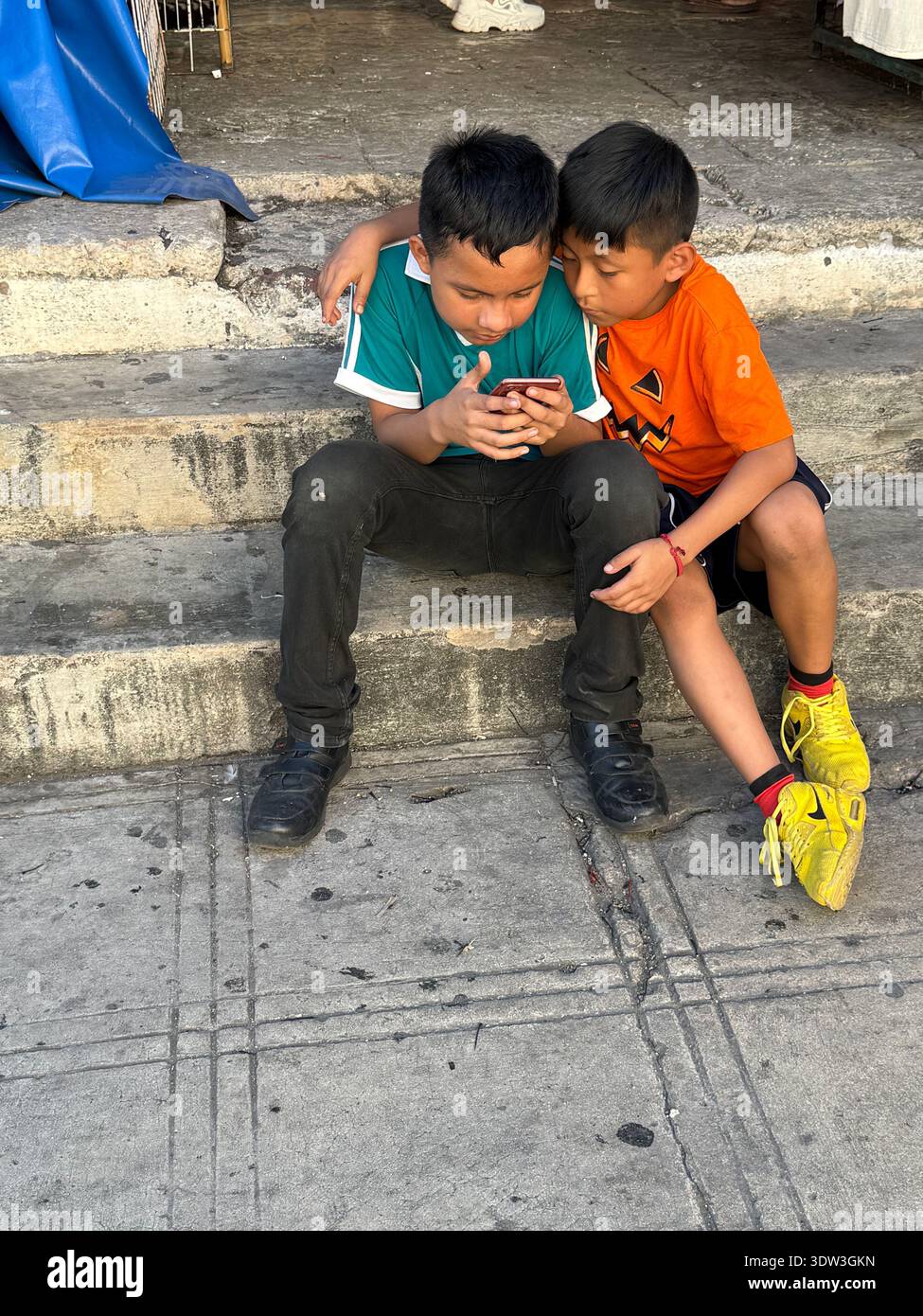 Mexican boys with a mobile phone, Merida Mexico Stock Photo - Alamy