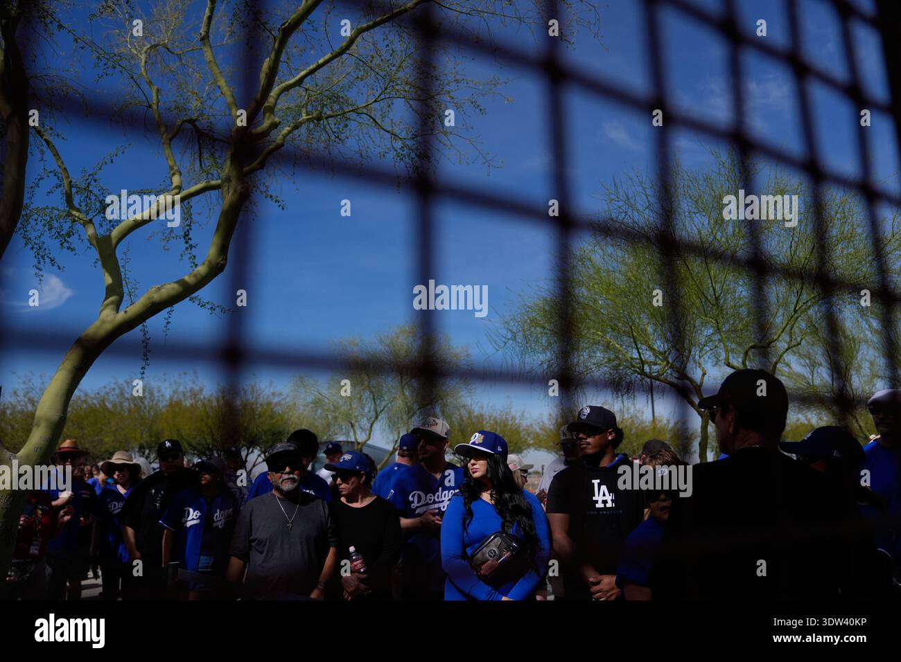 Los Angeles Dodgers baseball fans wait outside the gates to get into a ...