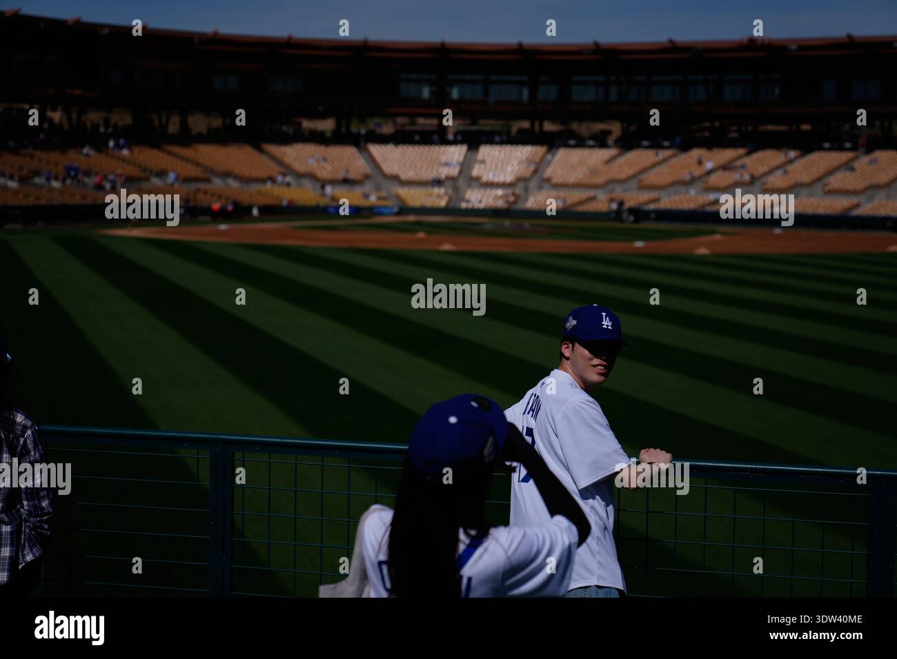 Los Angeles Dodgers baseball fans take pictures in the outfield during ...