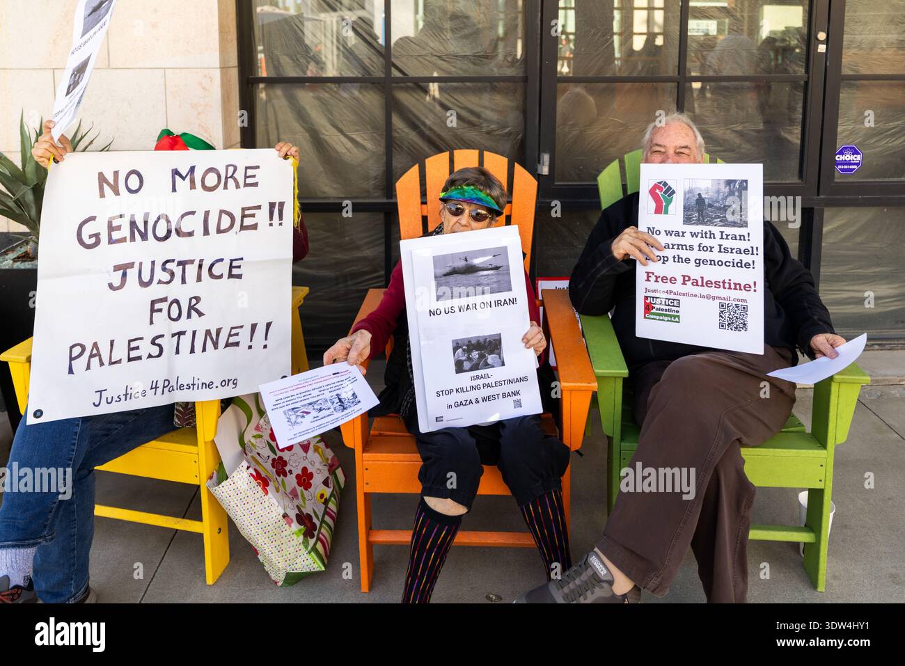 Demonstrators hold pro-Palestine and anti-war placards during a march ...