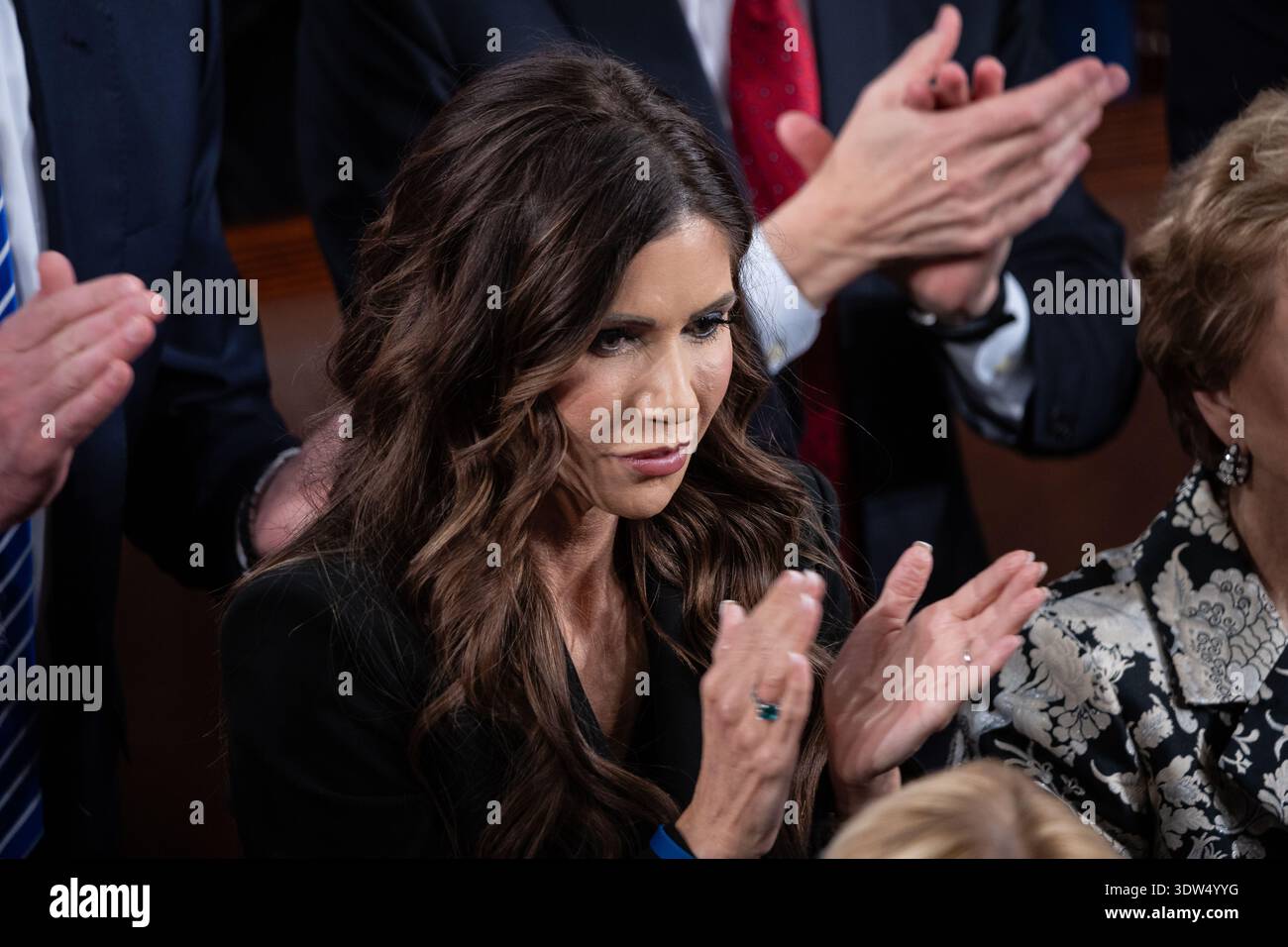 Homeland Security Secretary Kristi Noem applauds during the State of ...