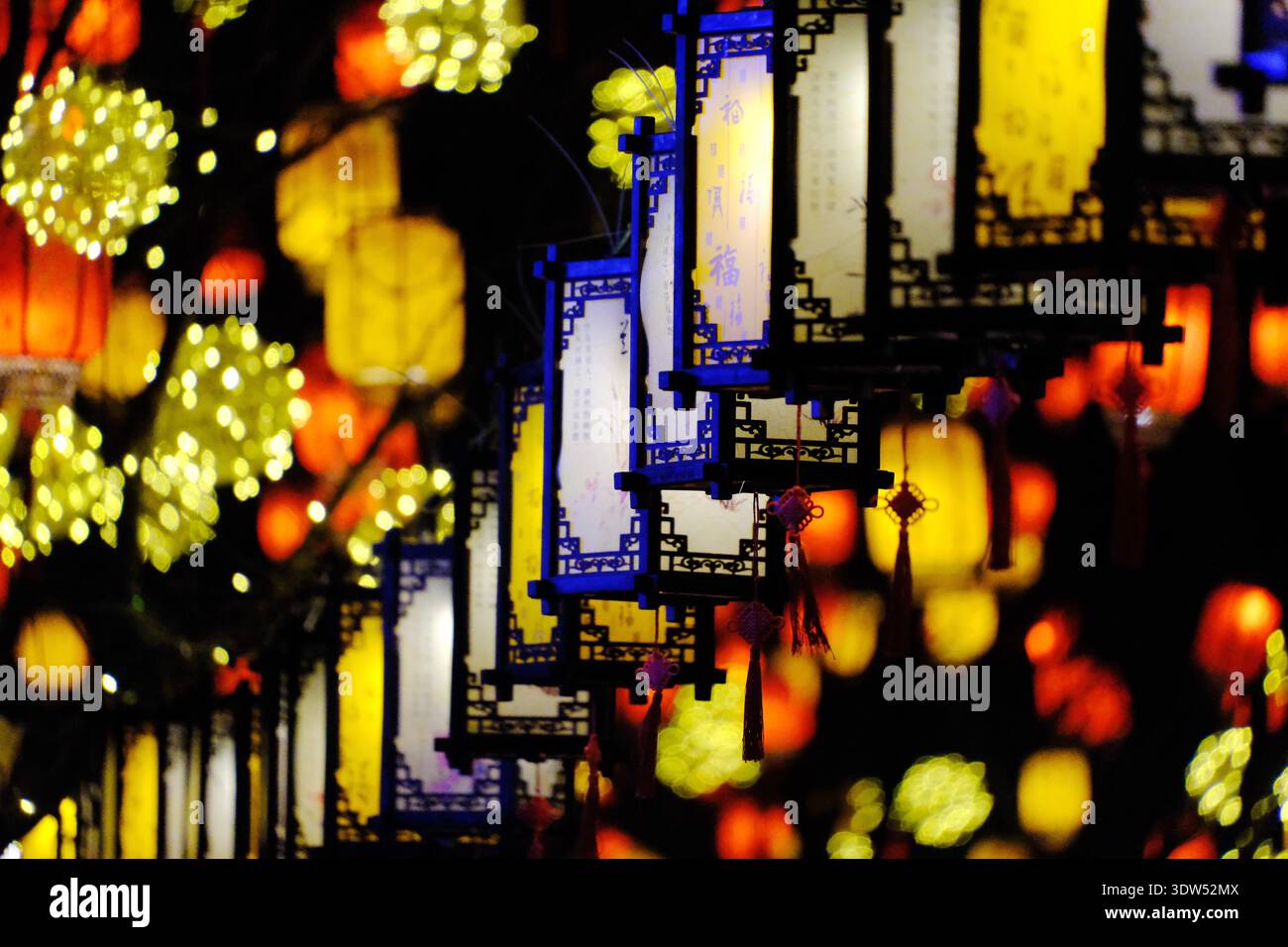 Visitors enjoy festive lanterns on Tongqing Street at the East Palace ...