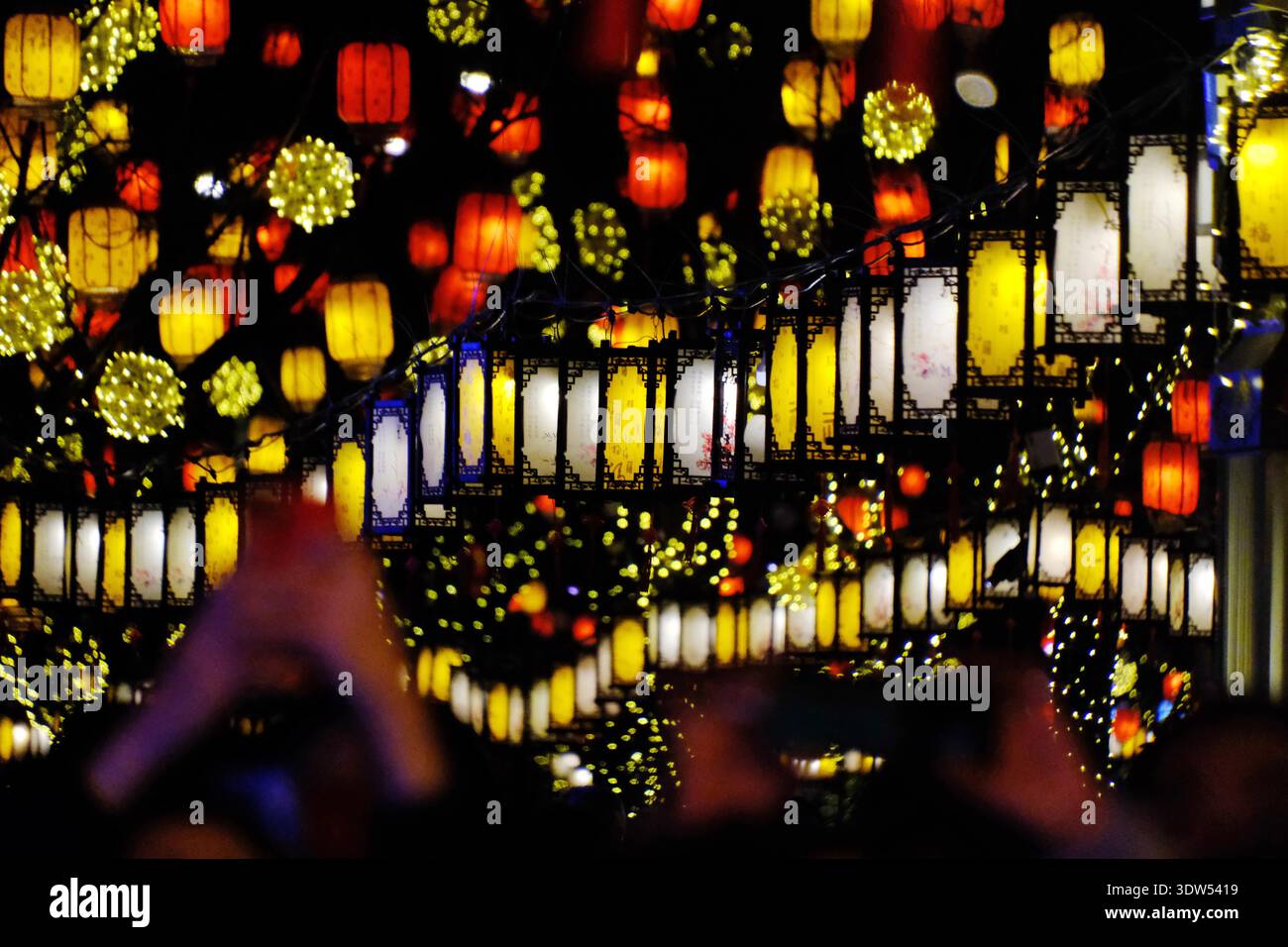 Visitors enjoy festive lanterns on Tongqing Street at the East Palace ...
