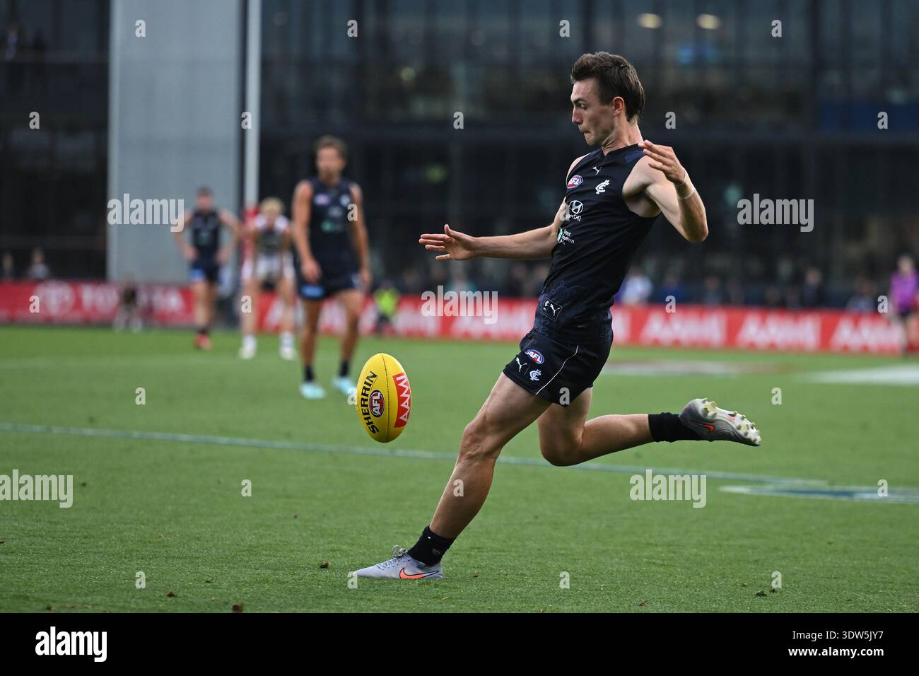 Jagga Smith of Carlton kicks the footy during the AFL Community Series ...