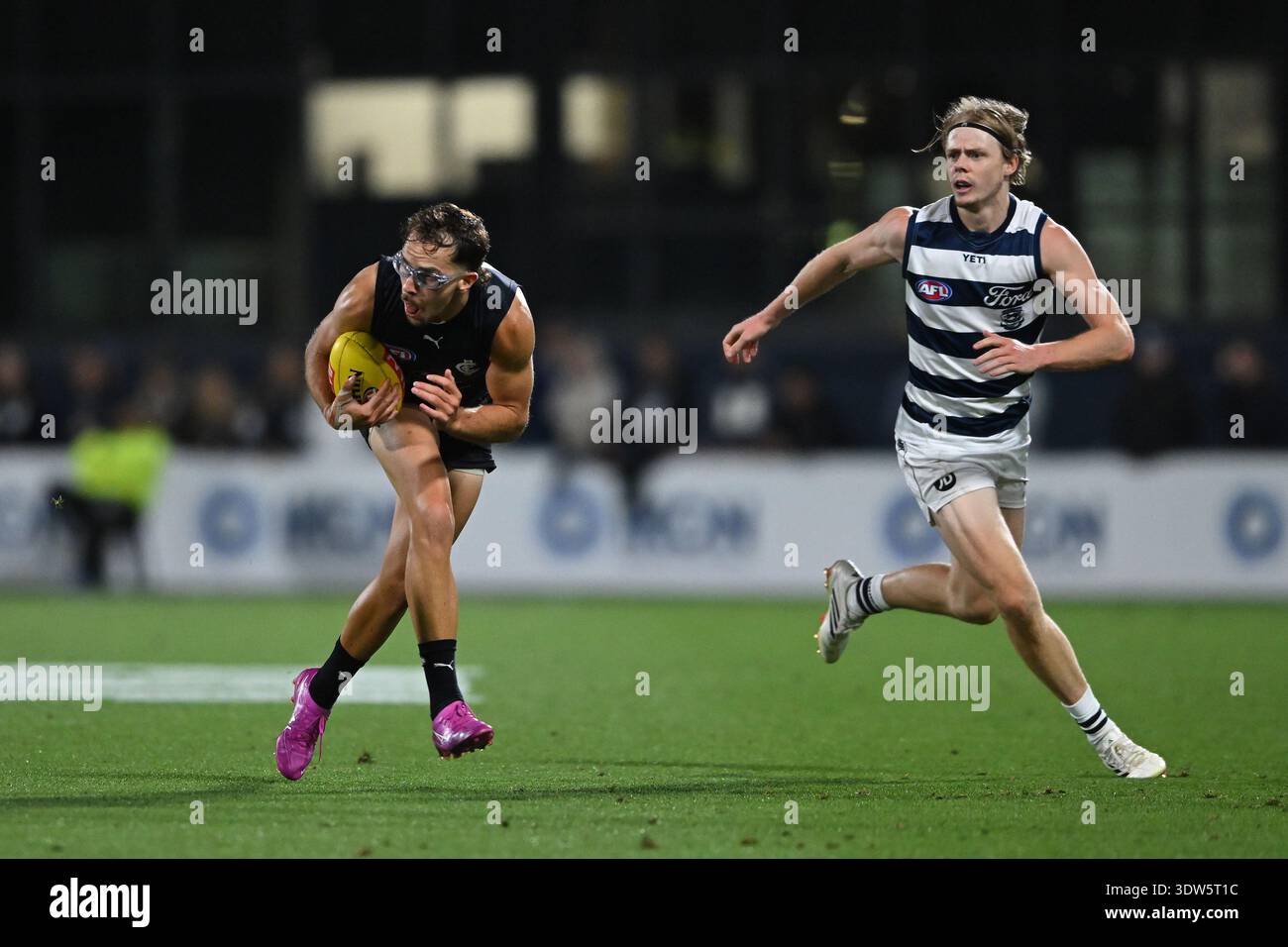 Francis Evans of Carlton (left) in action during the AFL Community ...