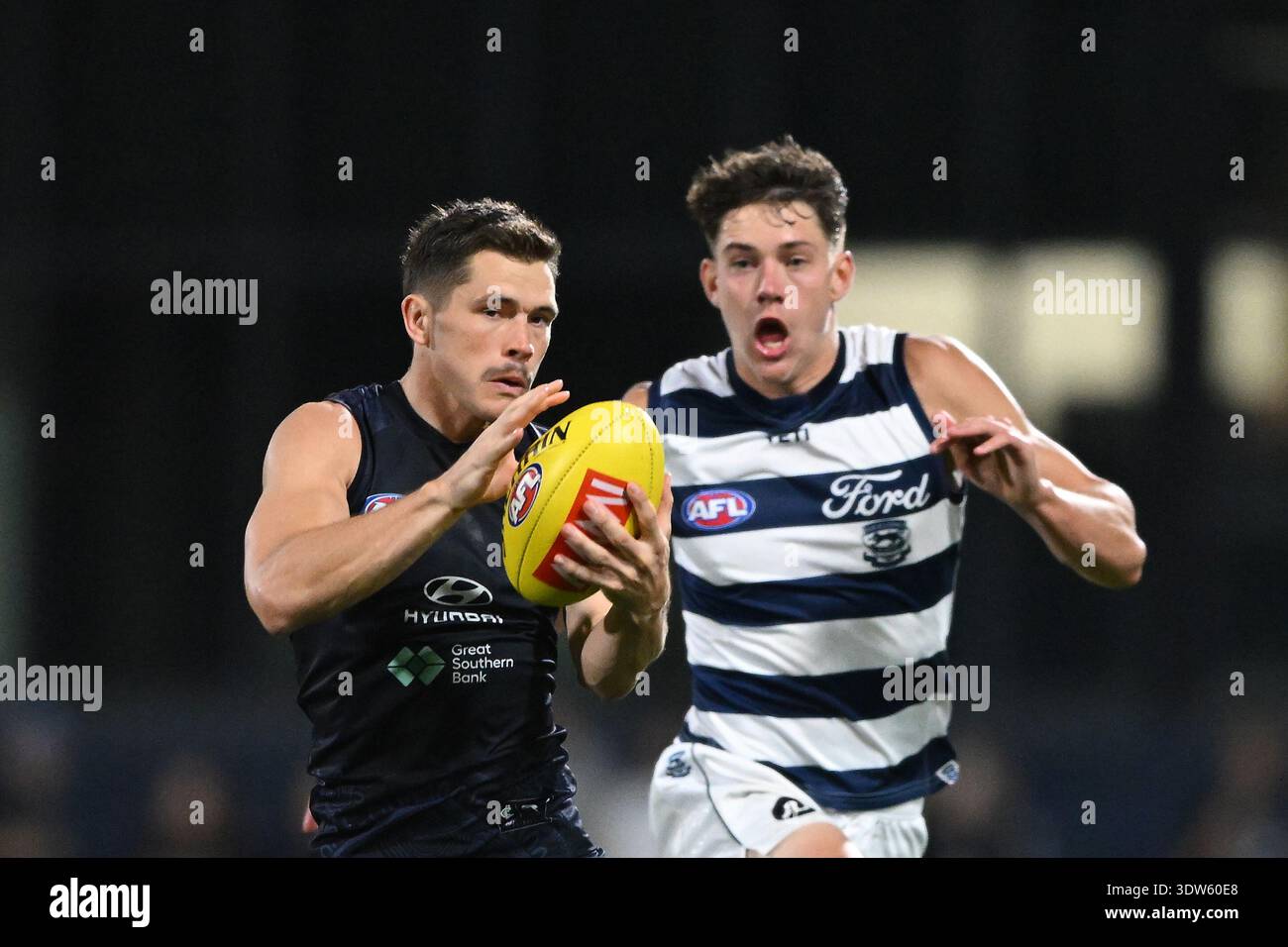 Ben Ainsworth of Carlton (left) in action during the AFL Community ...