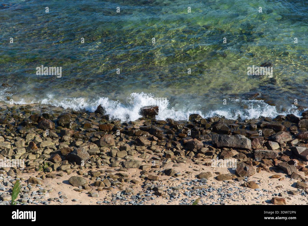 Pebbles stones bathed sea waves hi-res stock photography and images - Alamy
