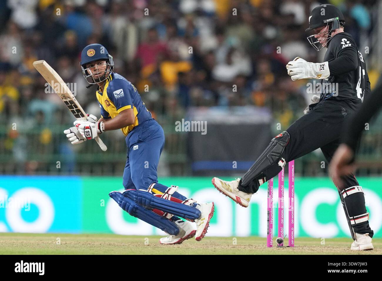 Sri Lanka's Dunith Wellalage looks back after plays a shot during the ...