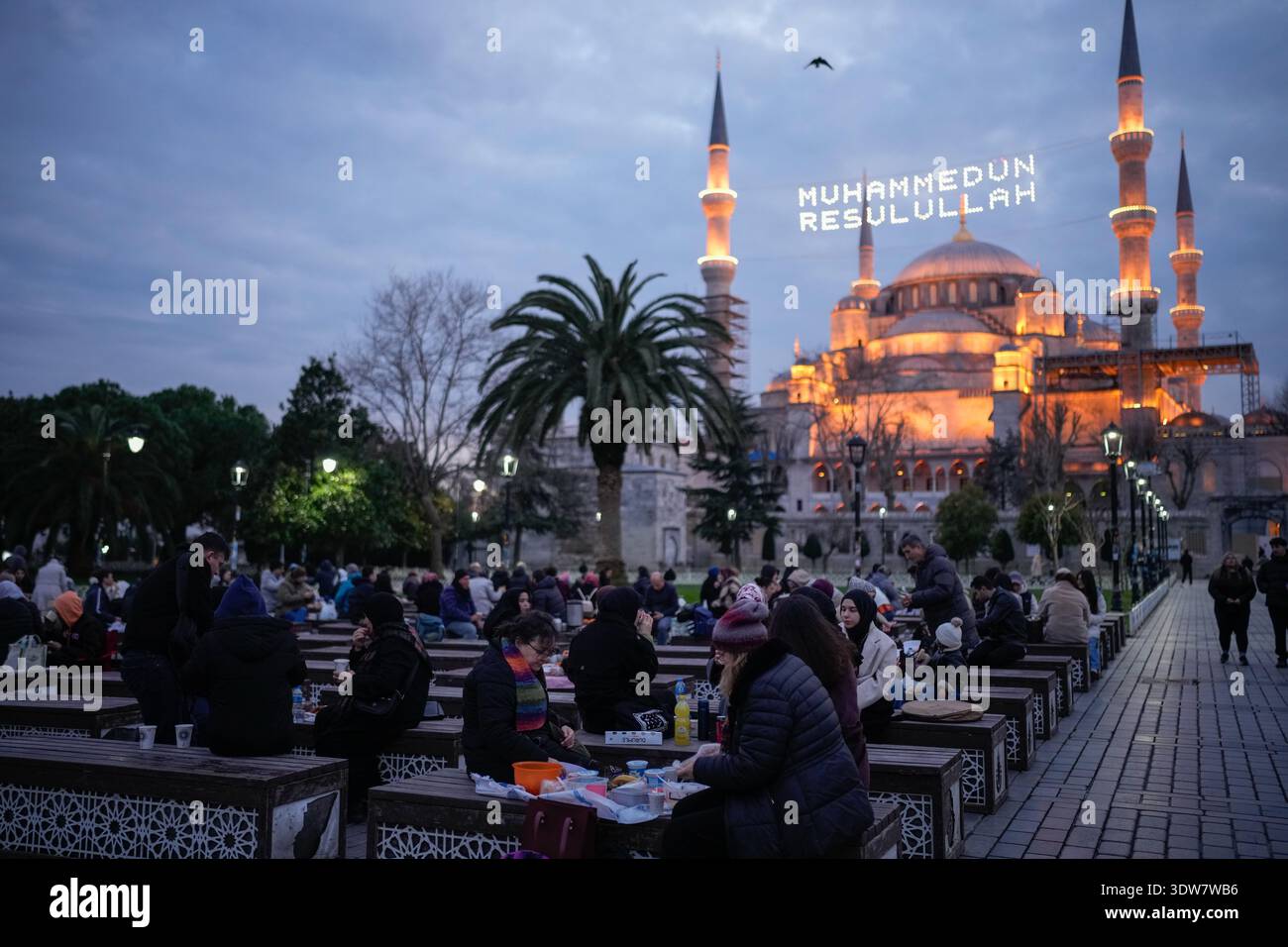 People break their fast after dusk during the Muslim holy fasting month ...