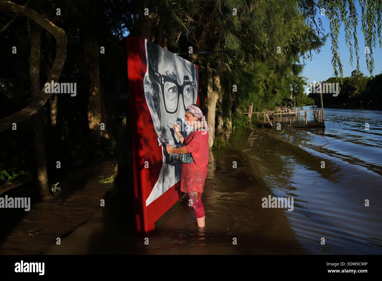 Artist Nora Basilio works on a painting of Argentine journalist and ...