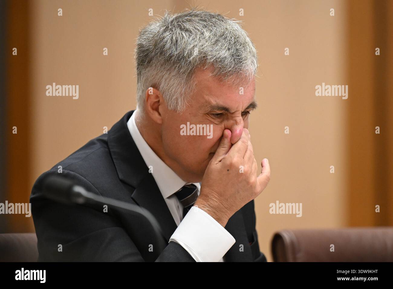 Optus CEO Stephen Rue reacts during the Triple Zero Service Outage ...