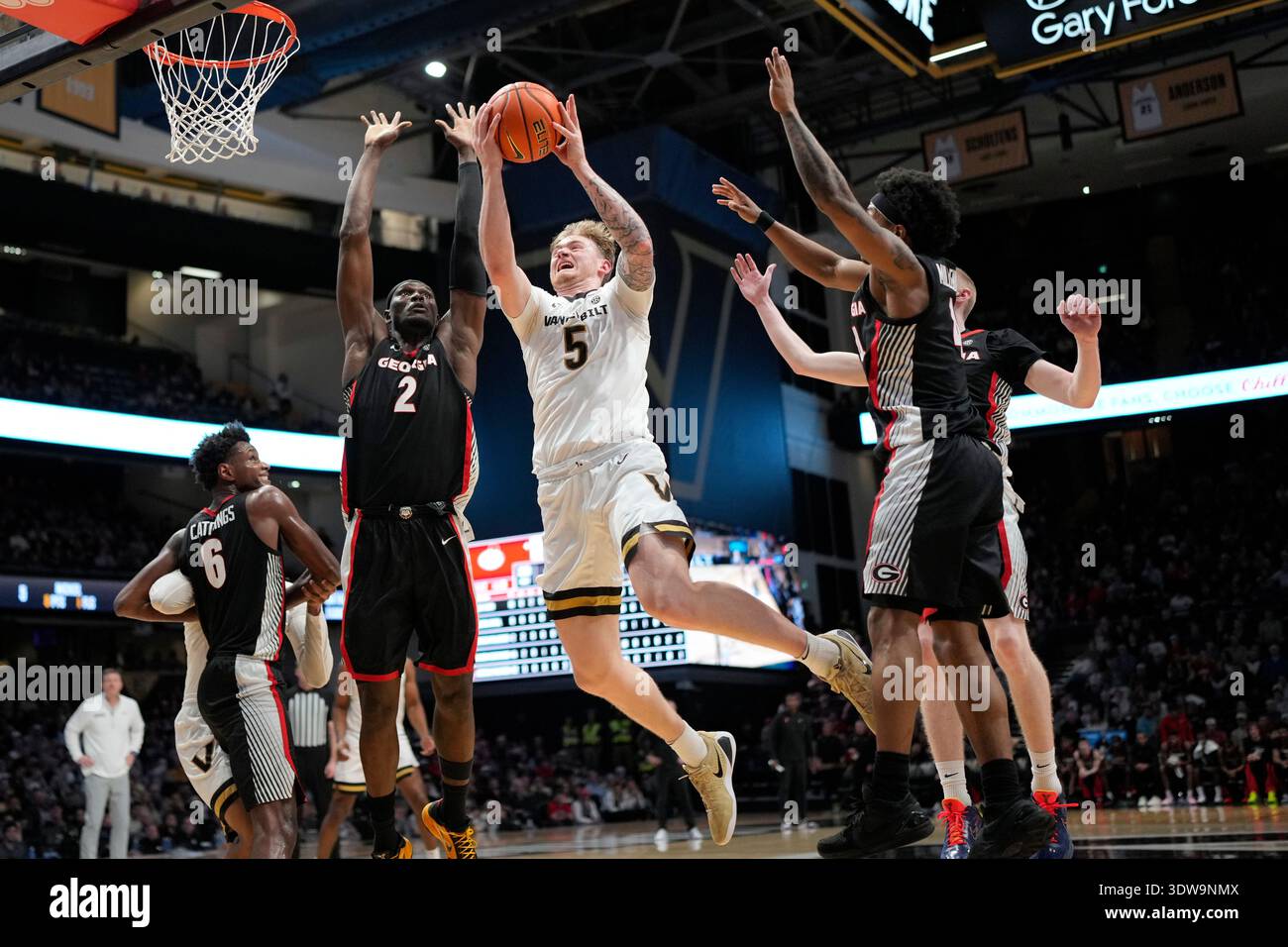 Vanderbilt forward Tyler Nickel (5) shoots the ball past Georgia center ...