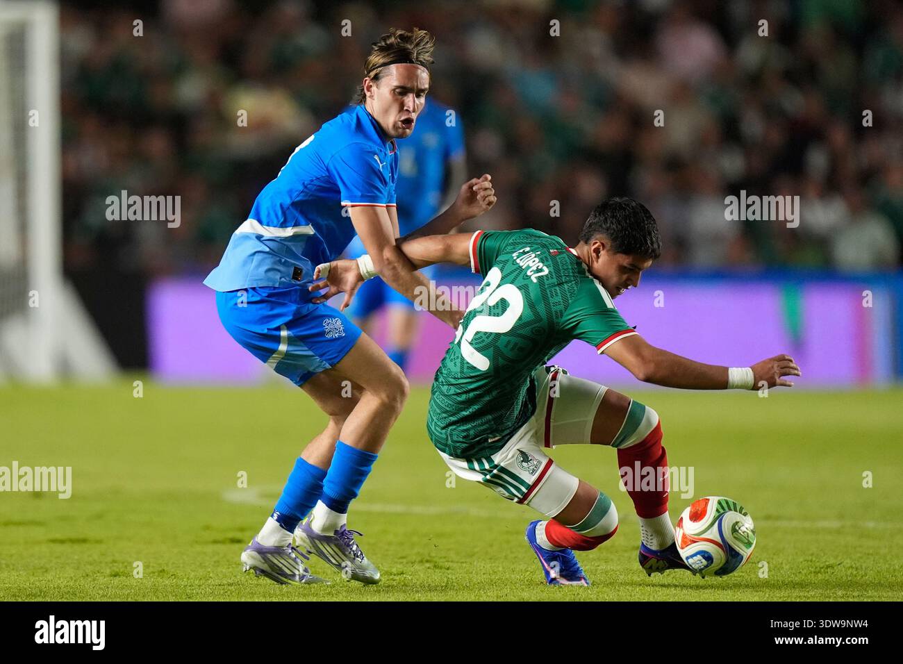 Mexico's Everardo López protects the ball from Iceland's Helgi ...