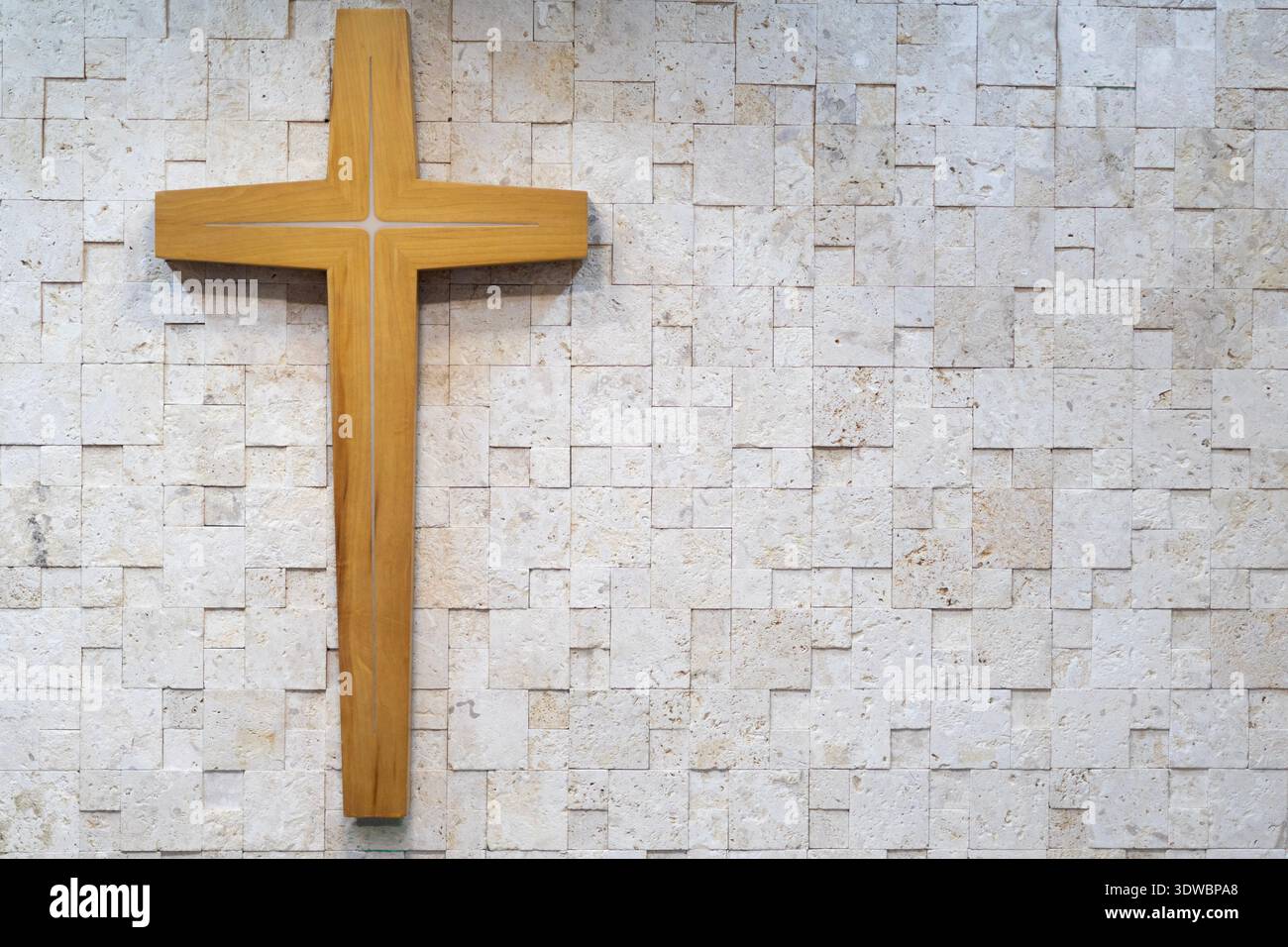 Modern church interior featuring a wooden Christian cross mounted on a ...