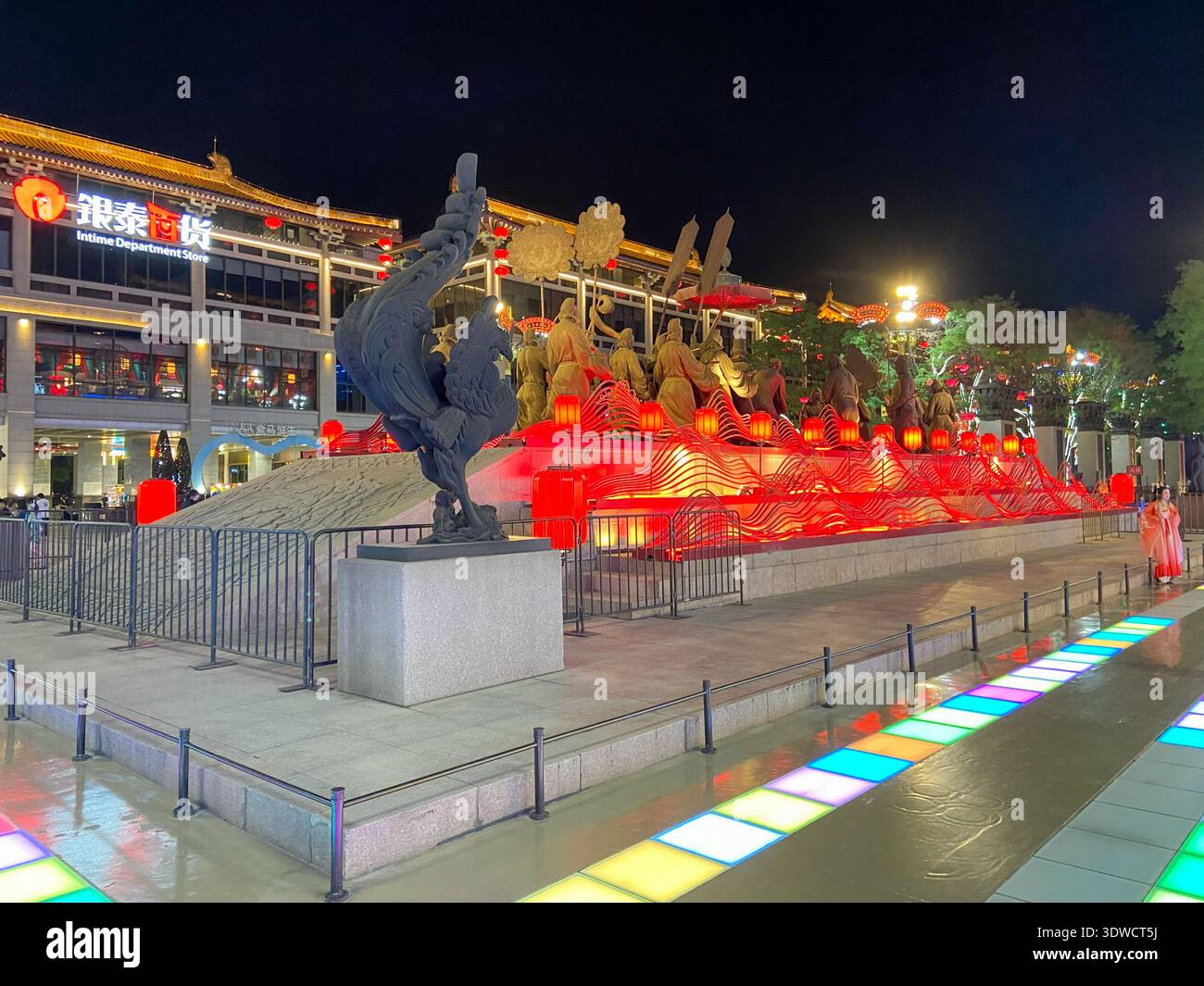 A vibrant night scene at the Grand Tang Dynasty Ever Bright City in Xi ...