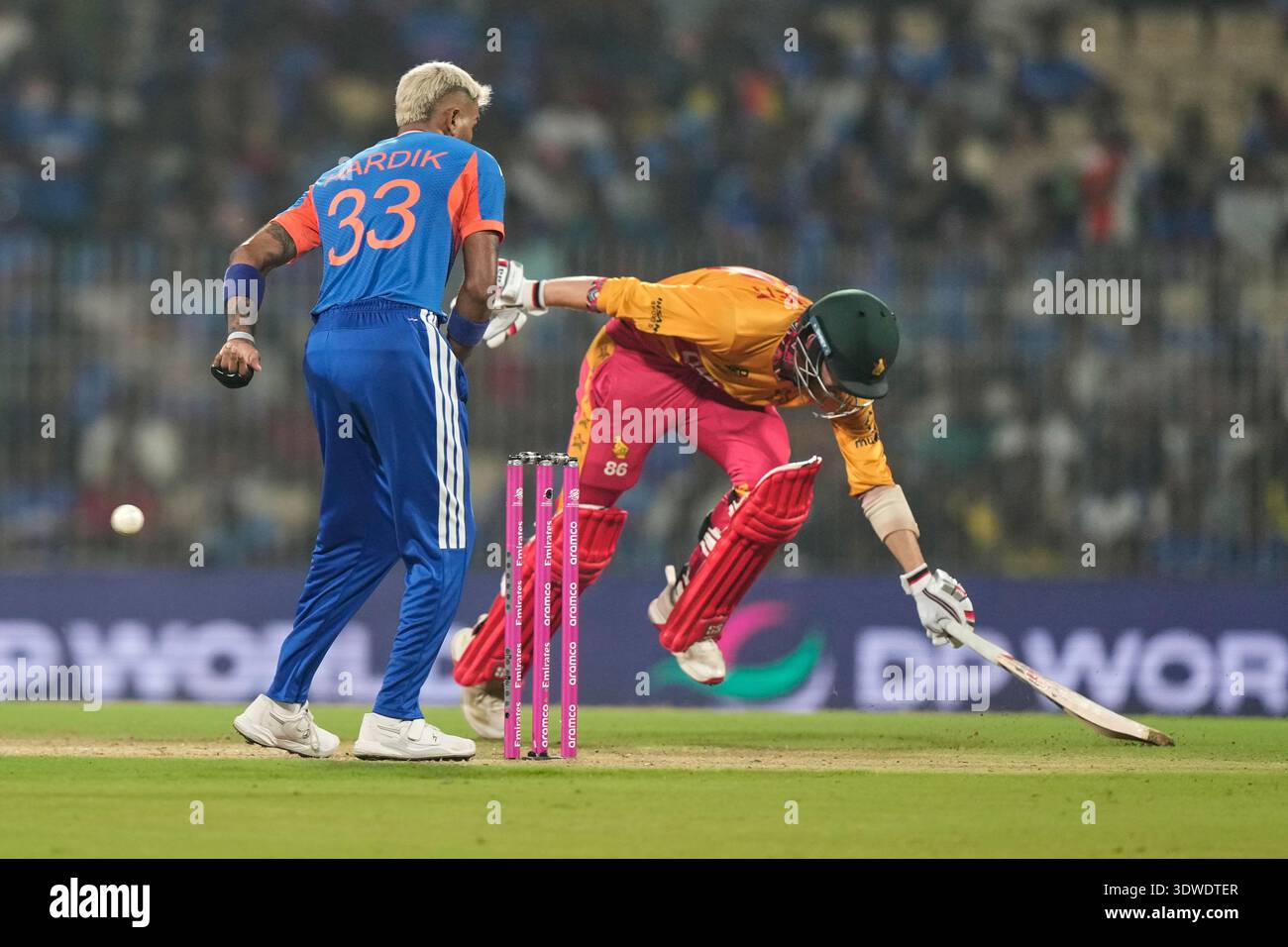 Zimbabwe's Brian Bennett, right, successfully completes a run during ...