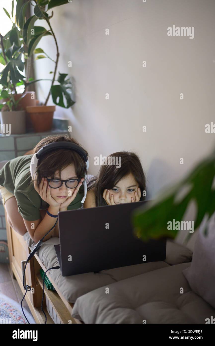 Two kids focused curious hi-res stock photography and images - Alamy