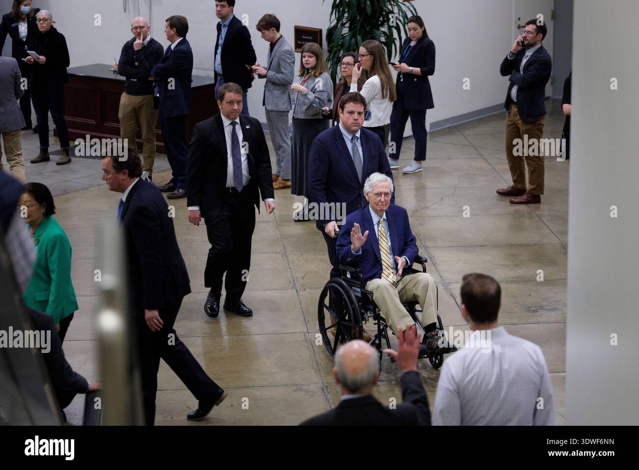 Sen. Mitch McConnell, R-Ky., waves while arriving for a Senate vote on ...
