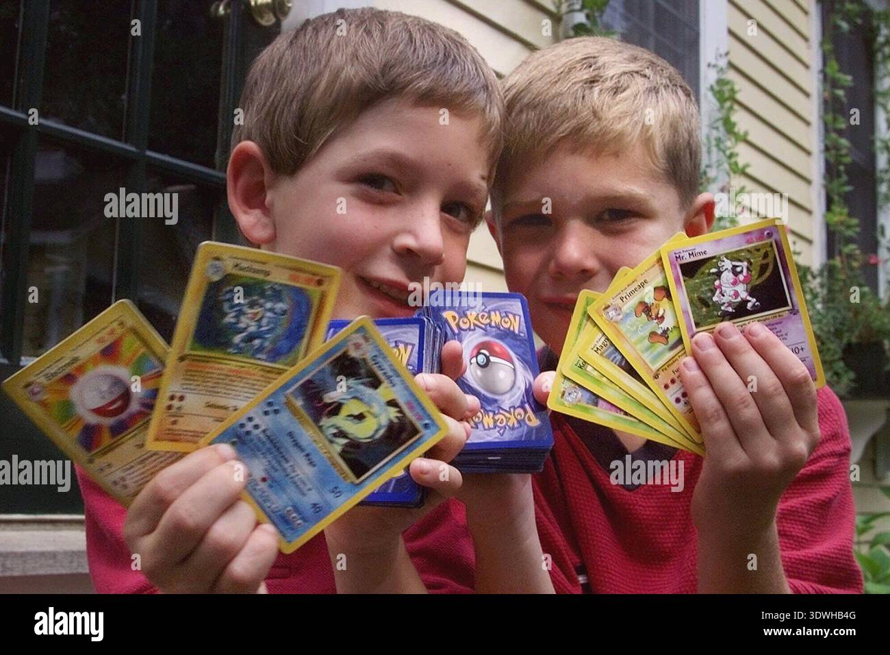 FILE - Tyler, right, and his friend George, hold up their favorite ...