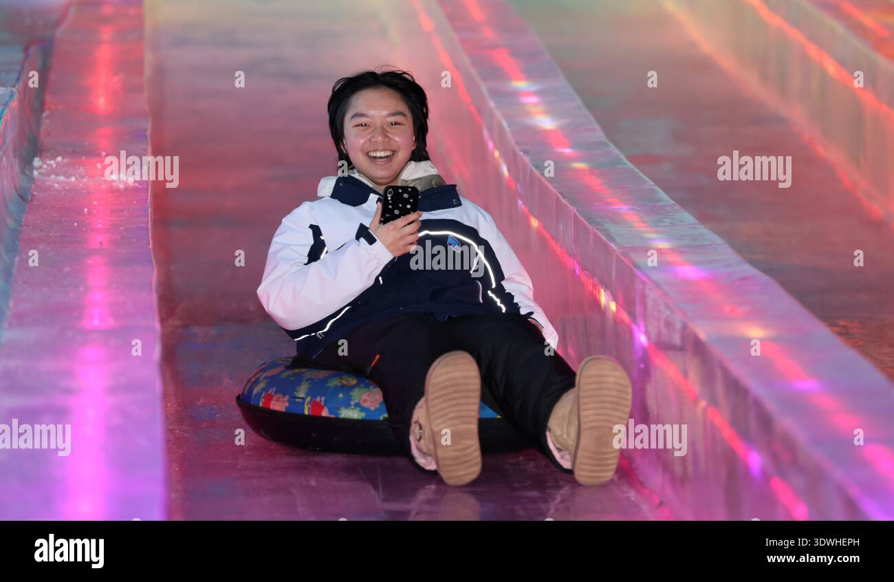 Visitors enjoy the newly upgraded Dream Ice and Snow Museum at Harbin ...