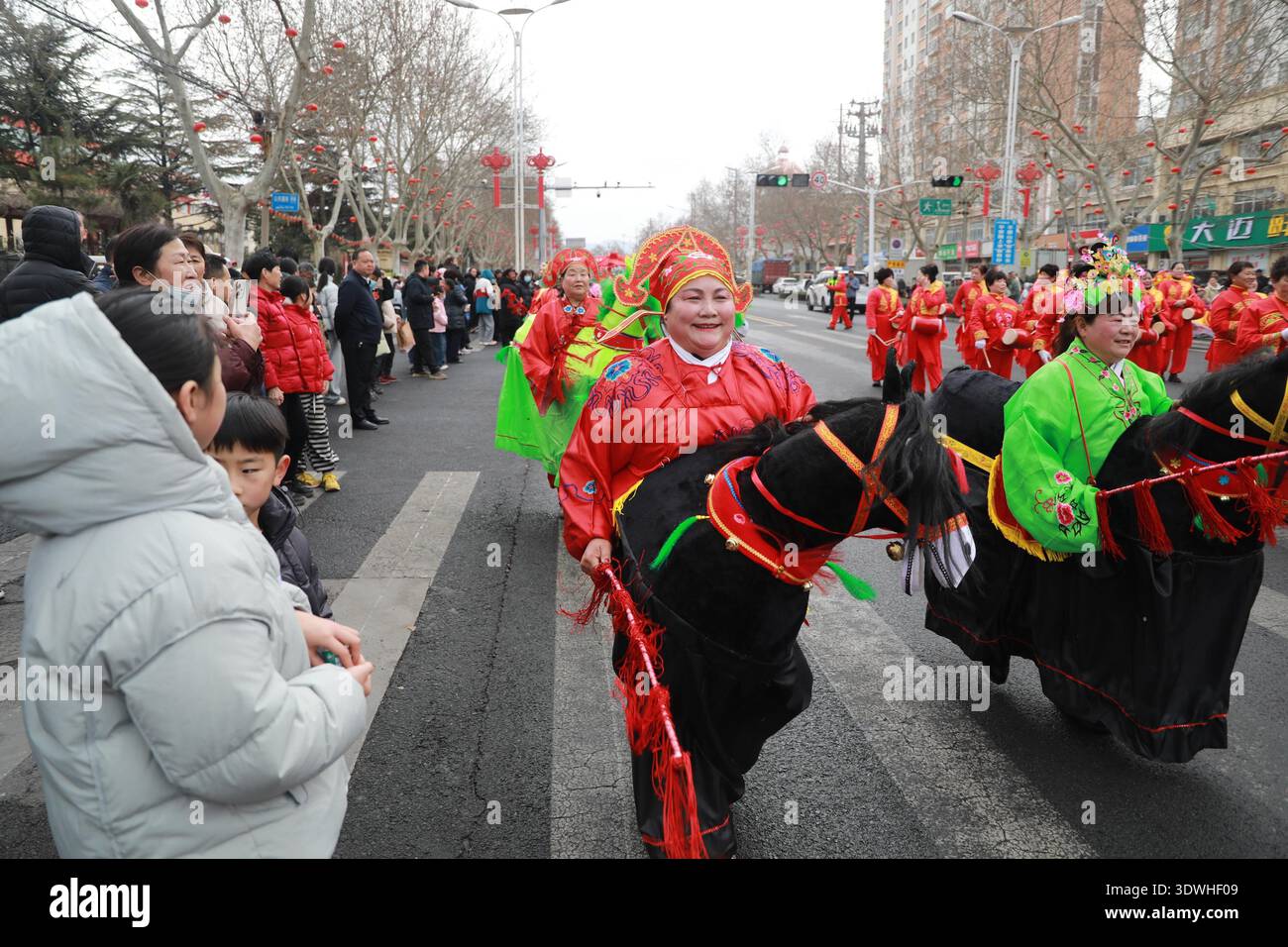 Farmers perform traditional dances during a Lunar New Year celebration ...