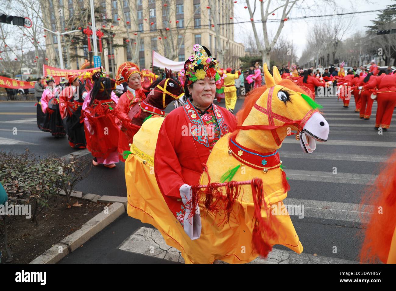 Farmers perform traditional dances during a Lunar New Year celebration ...