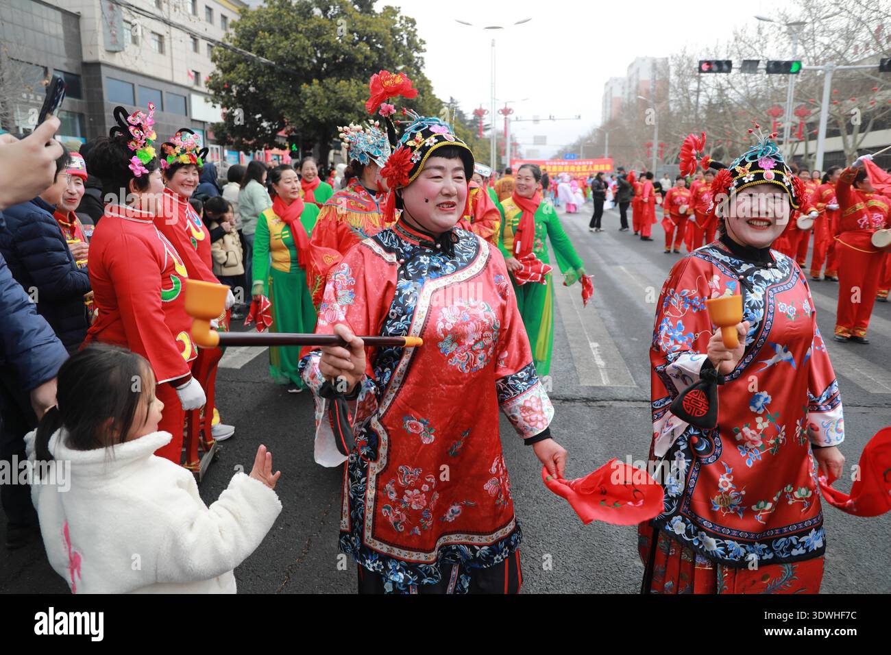 Farmers perform traditional dances during a Lunar New Year celebration ...