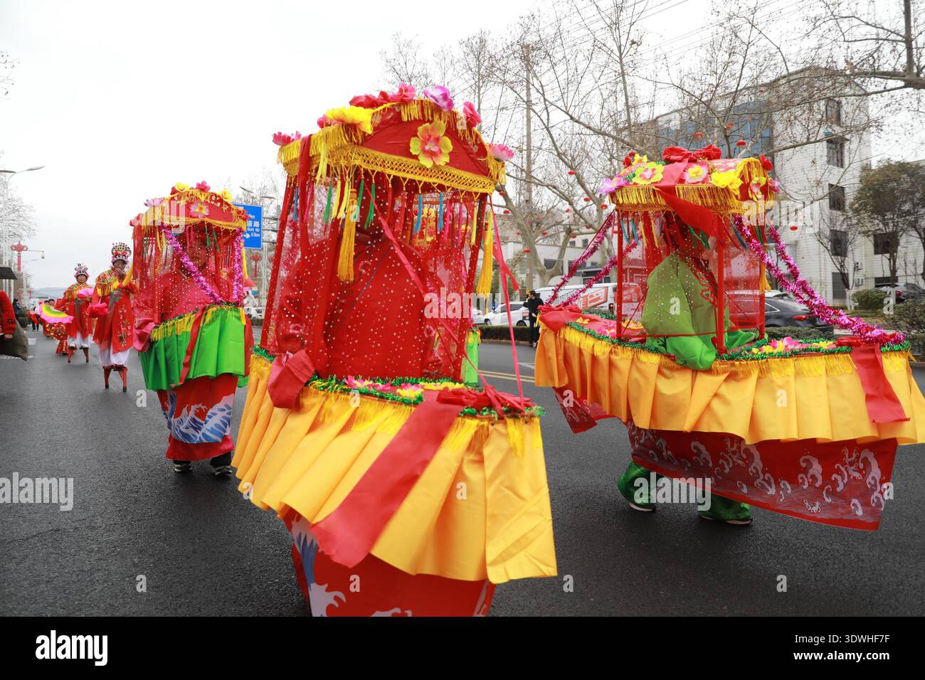 Farmers perform traditional dances during a Lunar New Year celebration ...