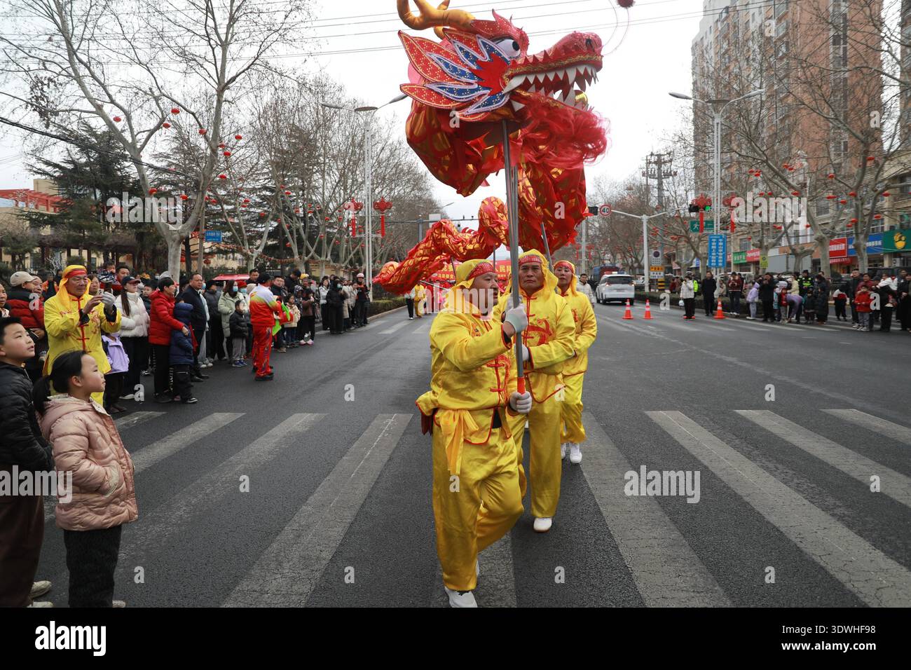 Farmers perform traditional dances during a Lunar New Year celebration ...