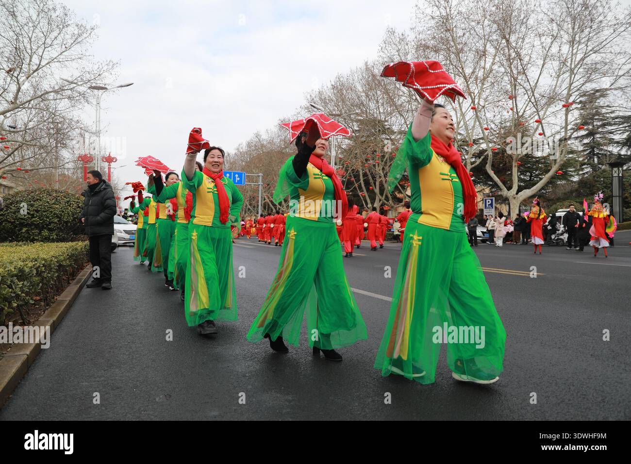 Farmers perform traditional dances during a Lunar New Year celebration ...