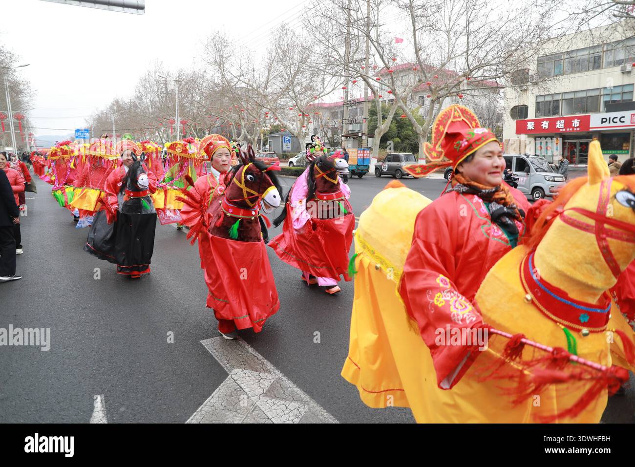 Farmers perform traditional dances during a Lunar New Year celebration ...