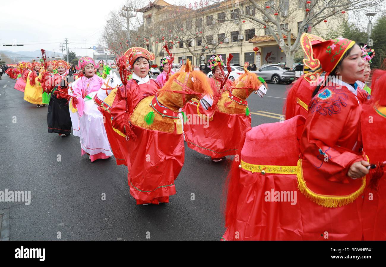 Farmers perform traditional dances during a Lunar New Year celebration ...