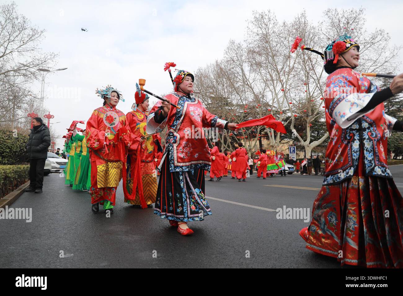 Farmers perform traditional dances during a Lunar New Year celebration ...