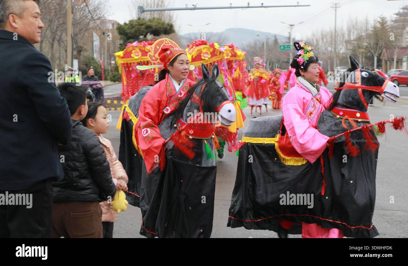Farmers perform traditional dances during a Lunar New Year celebration ...