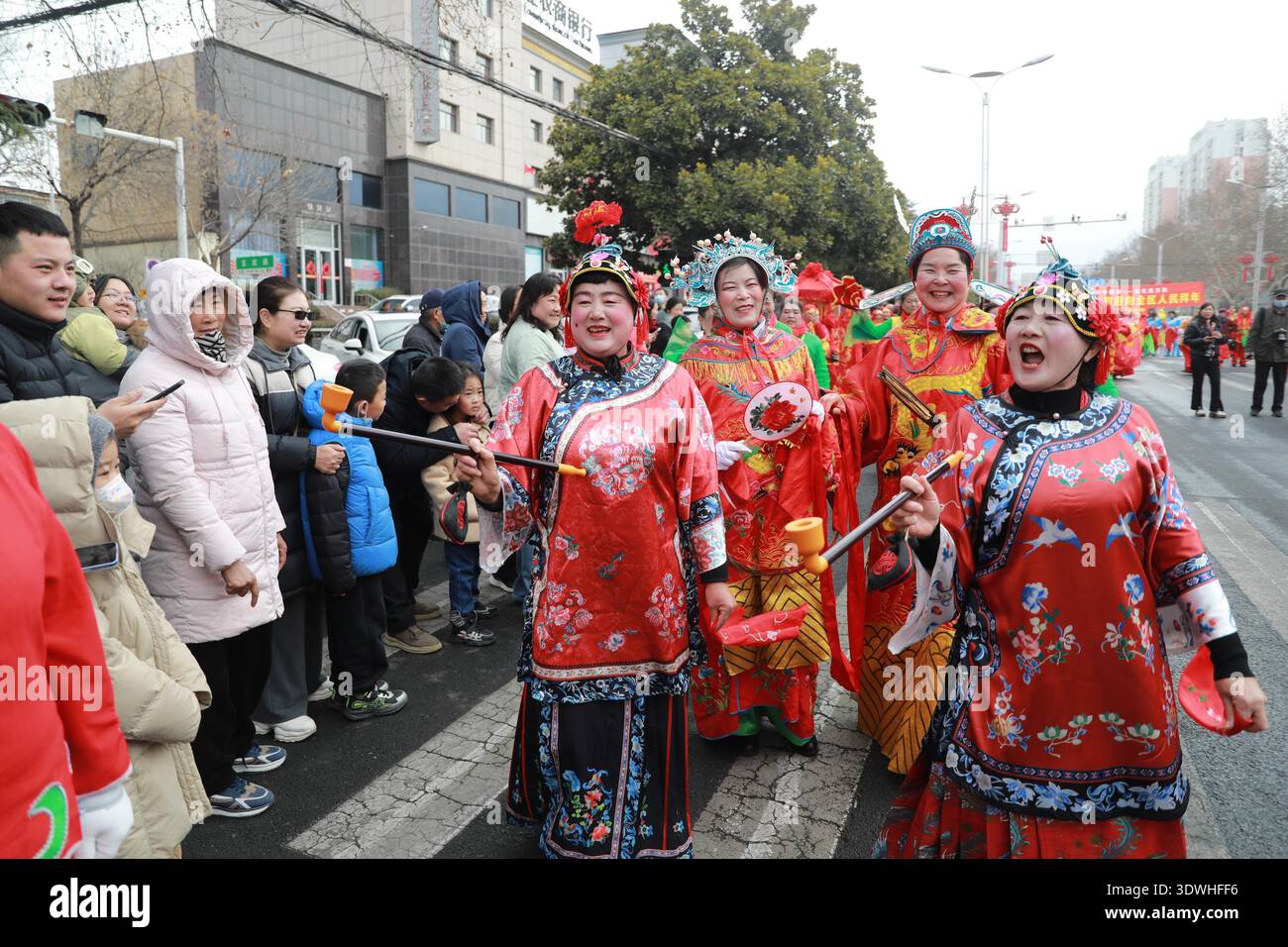 Farmers perform traditional dances during a Lunar New Year celebration ...